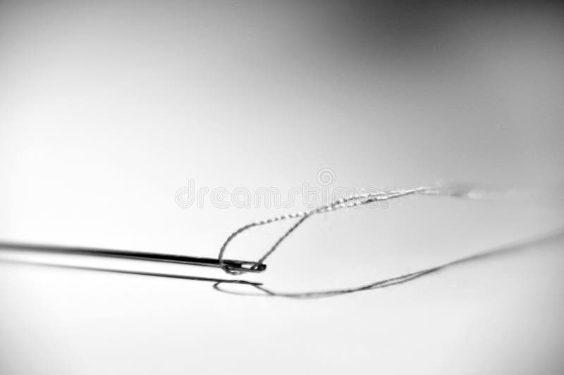 Threaded Needle Close-up on the Thread the Head of the Eye of the ...