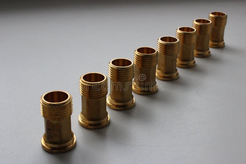 Copper Threaded Fittings For Water Pipe Connection Lined Up On White Background Stock Image