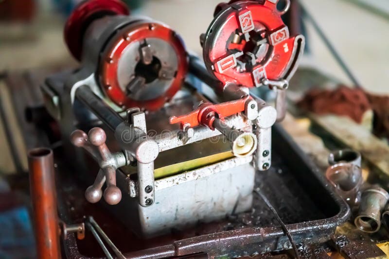 Threading Machine for Iron Pipes in a Construction Site Stock Photo ...