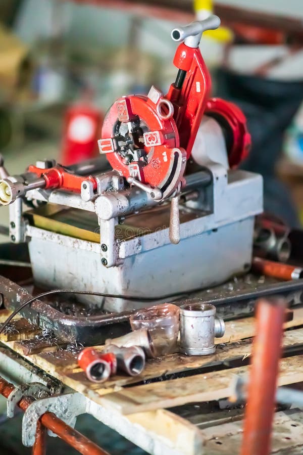 Threading Machine for Iron Pipes in a Construction Site Stock Image ...