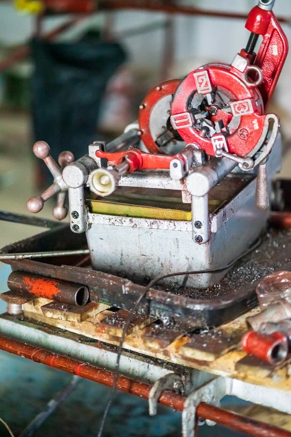 Threading Machine for Iron Pipes in a Construction Site Stock Photo ...