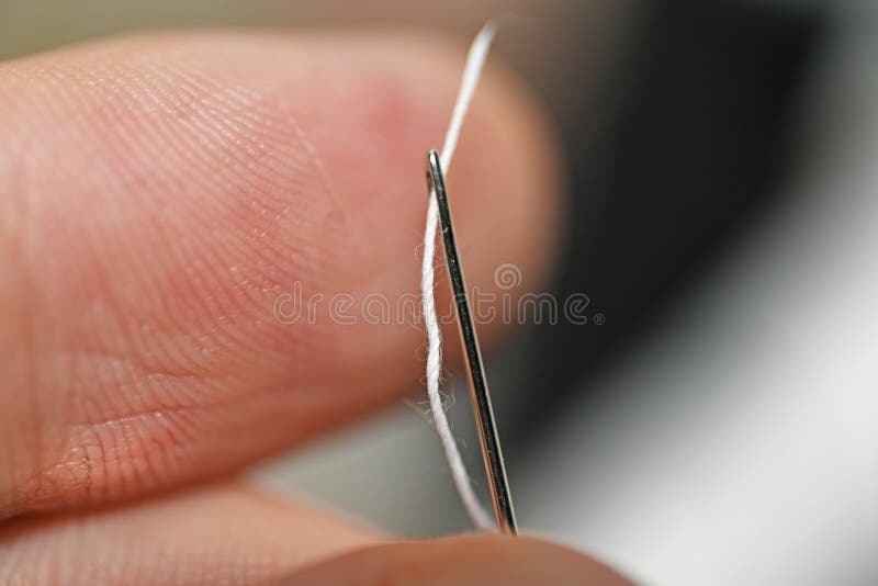 Man Threading Needle Stock Photos - Download 70 Royalty Free Photos