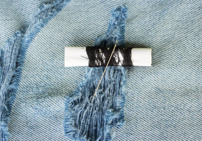 Threads and Needle on Jeans Backround Stock Photo - Image of backround ...