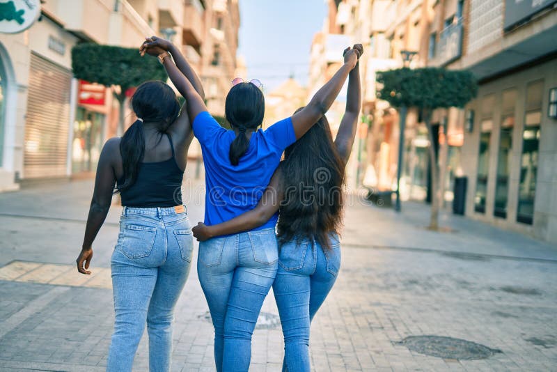 Three African American Friends on Back View Walking at the City Stock ...