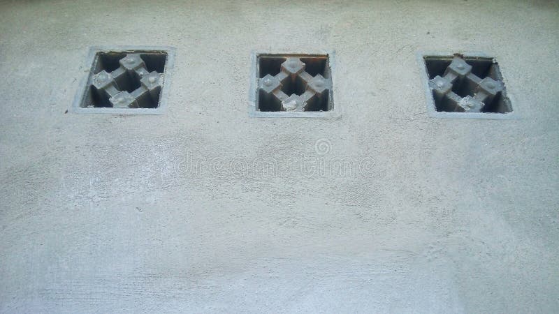 Three Air Vents Mounted on the Wall in a Square Shape, Visible from the ...