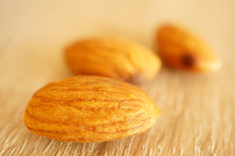 Three almonds stock photo. Image of wood, three, commodity - 49657490