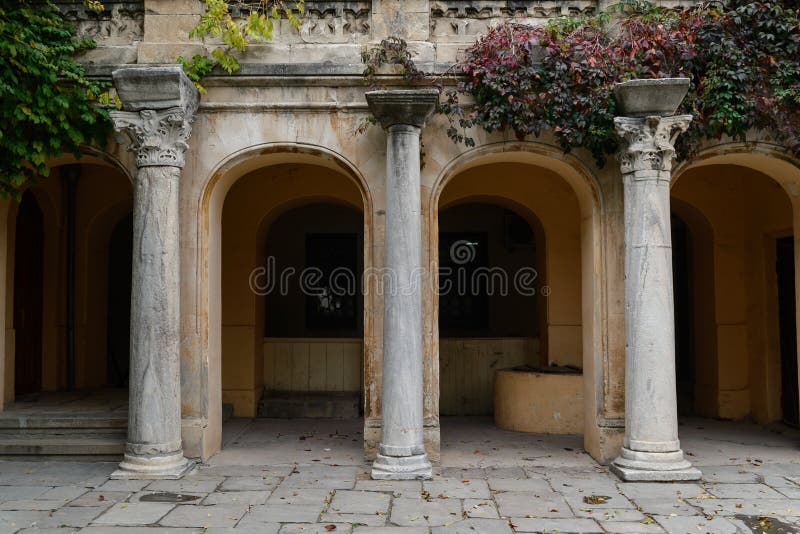 Three Ancient Columns on the Facade of the Building Stock Image - Image ...