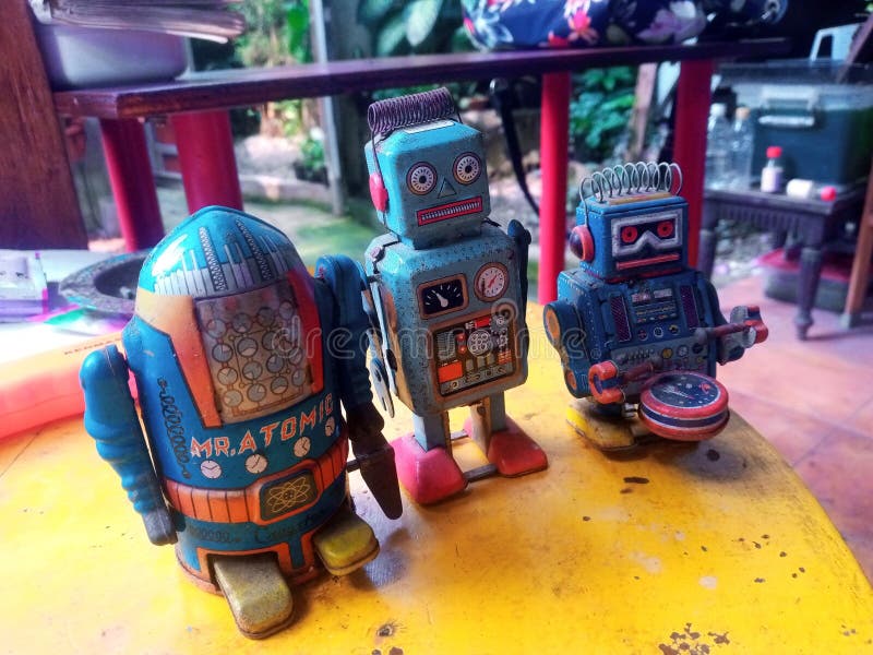 Three ancient robot toys stock photo. Image of three - 322677266