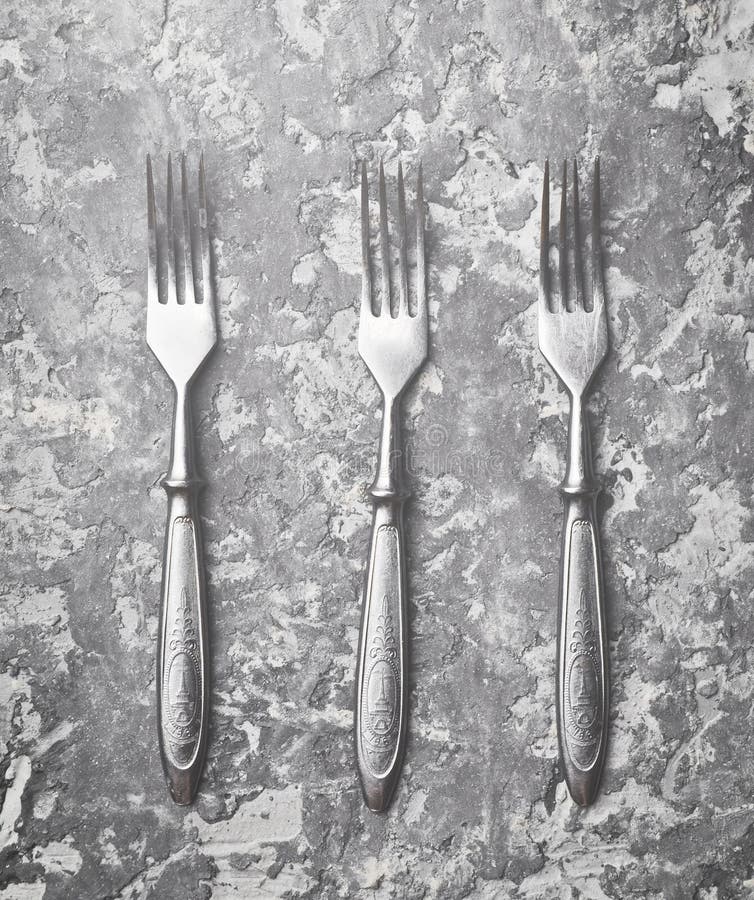 Three Antique Forks on a Gray Concrete Table. Top View Stock Photo ...