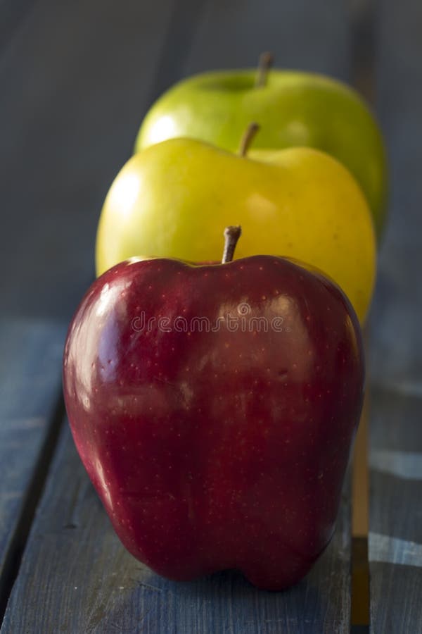Three Apple Stop Light on Blue Wood Stock Image - Image of blue, stop ...