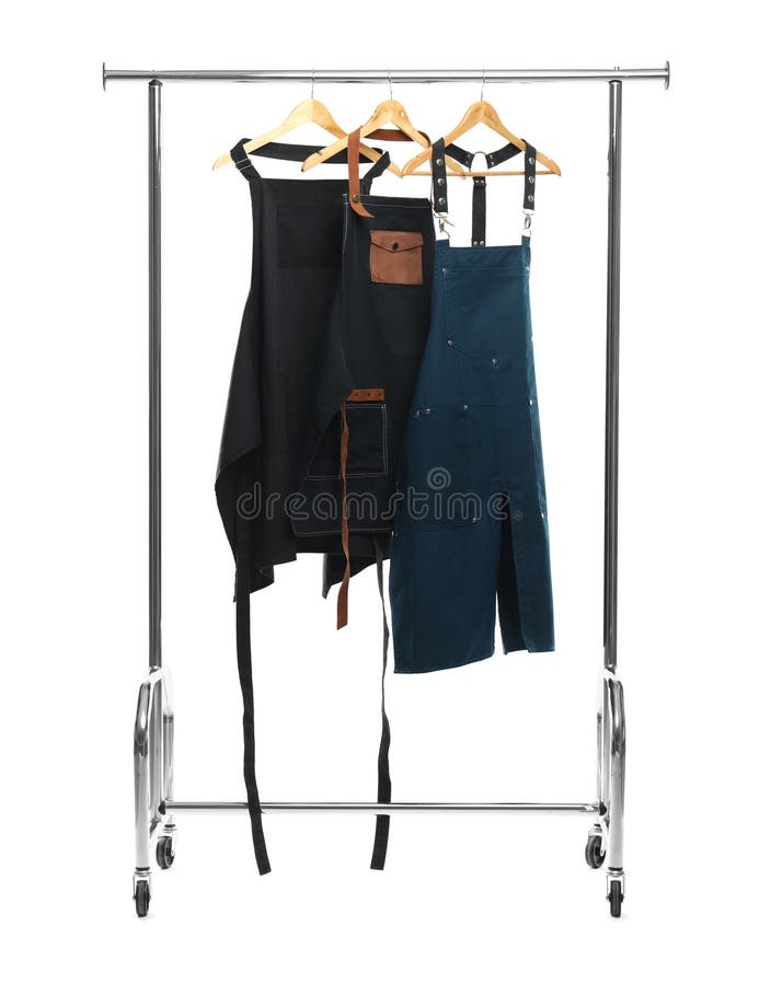 Three Aprons on Clothing Rack Isolated on White Stock Photo - Image of ...
