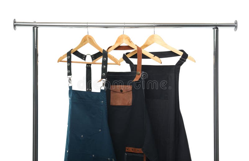 Three Aprons on Clothing Rack Isolated on White Stock Photo - Image of ...