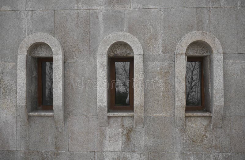 3 Three Arched Classic Windows in Granite Exterior Wall. Small Wooden ...