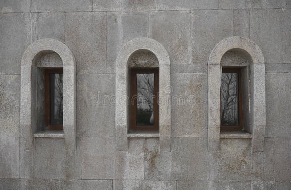 3 Three Arched Classic Windows in Granite Exterior Wall. Small Wooden ...