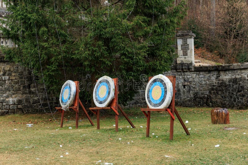 Three Archery Targets Outdoors in a Forested Area with Stone Wall Stock ...