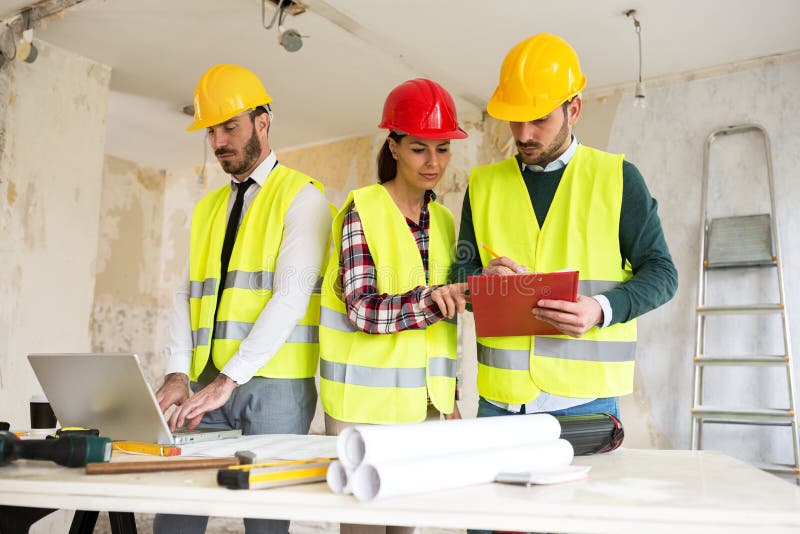 Three Arhitects Working Together on Construction Site Project Stock ...