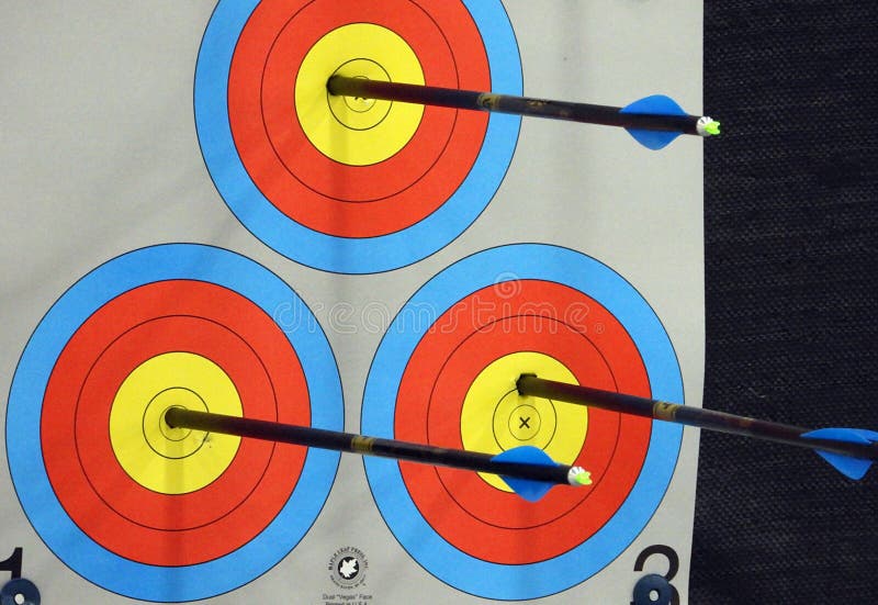 Arrows Hitting a Bullseye on a Target Board Stock Illustration ...