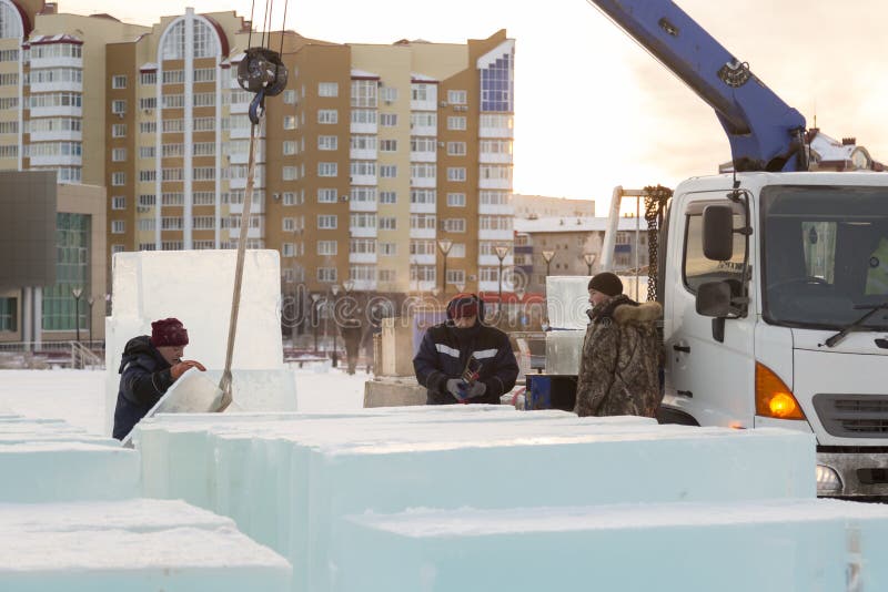 Installers Store Ice Blocks for the Ice Town Stock Photo - Image of ...