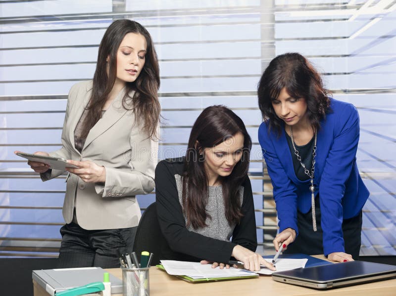 Three Attractive Female Colleagues Working in the Office Stock Photo ...