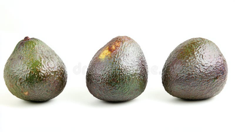 Three Avocados Arranged in a Row on a Plain White Surface. Stock Photo ...