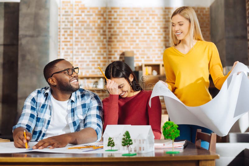Three Awesome Optimistic Colleagues Working on Project Stock Image ...