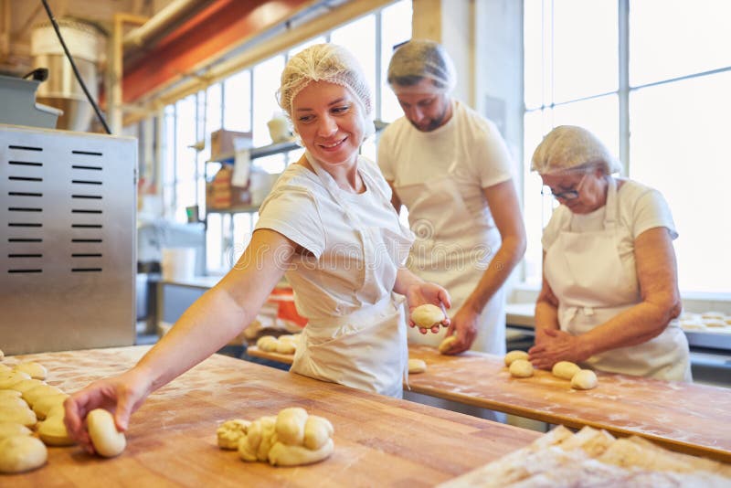 Bakers Bake Together Small Buns in Bakery Stock Photo - Image of ...