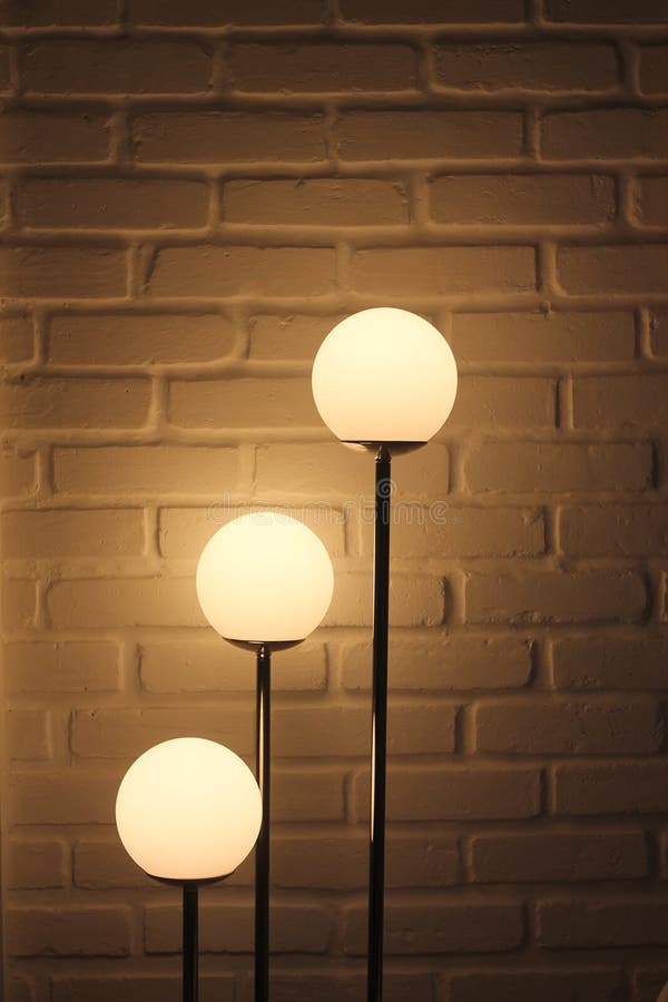 Three Ball Lights & White Brick Wall Stock Photo - Image of light ...
