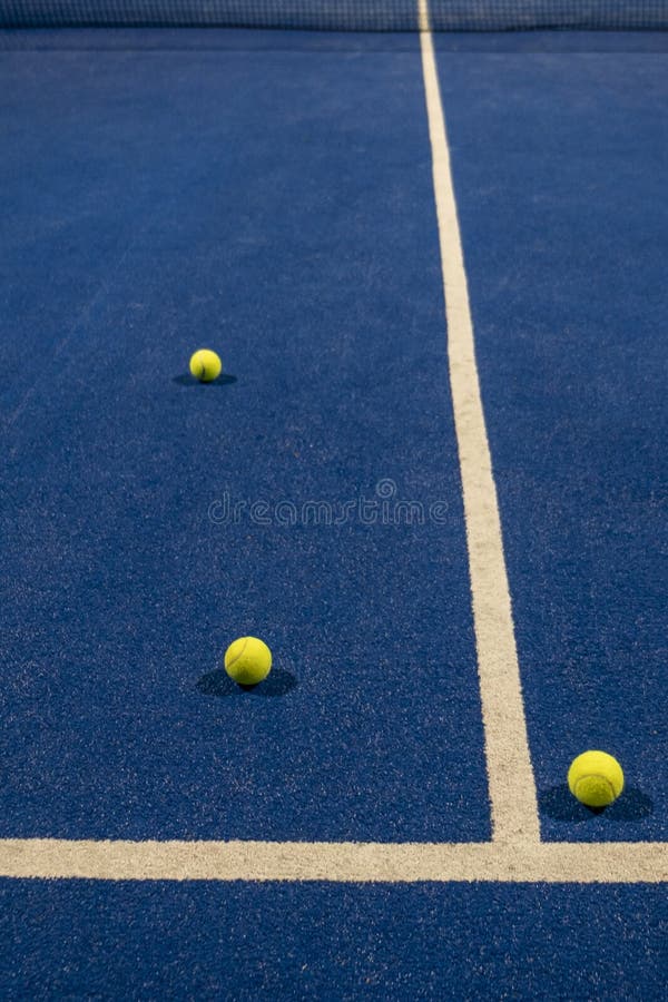 Three Balls on the Surface of a Blue Paddle Tennis Court Stock Image ...