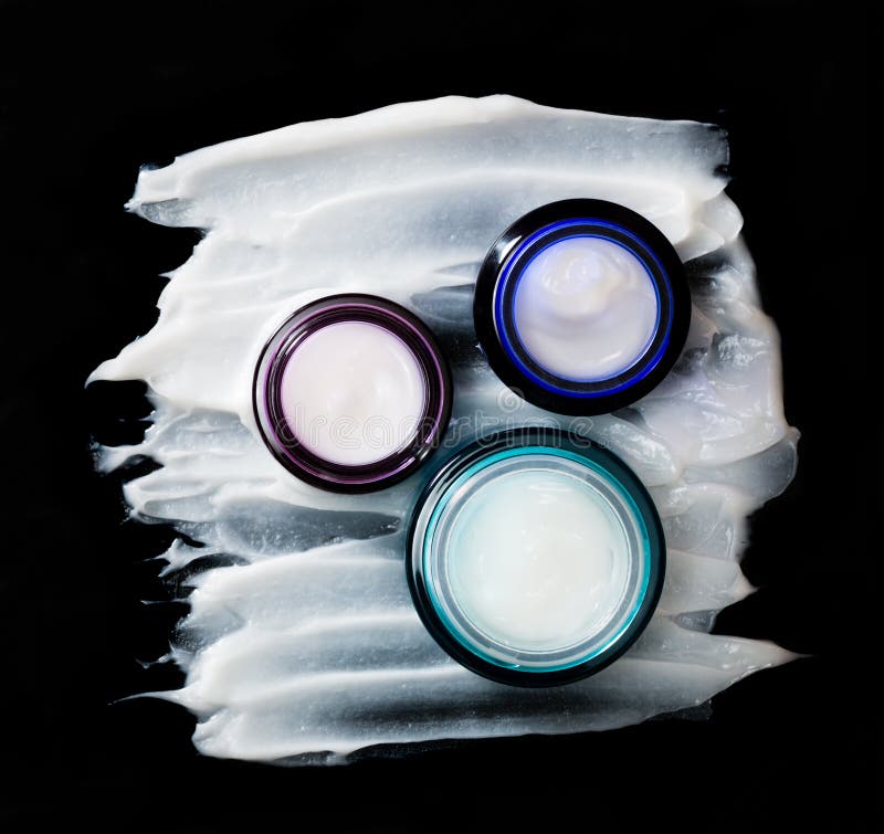 Three Banks of Face Cream on a Smeared Surface Stock Image - Image of ...