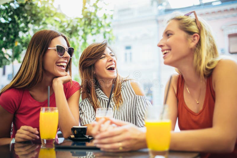 Three Friends in a Cafe Having Fun Stock Image - Image of casual ...