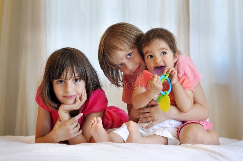 Three Beautiful Kids Playing Together Stock Photo - Image of interior ...