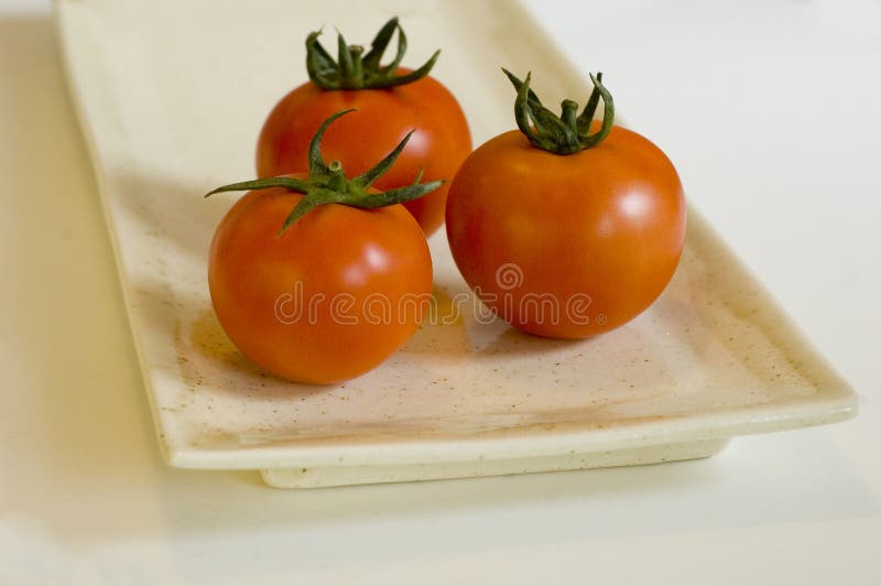 Three beautiful tomatoes stock image. Image of isolated - 7469841