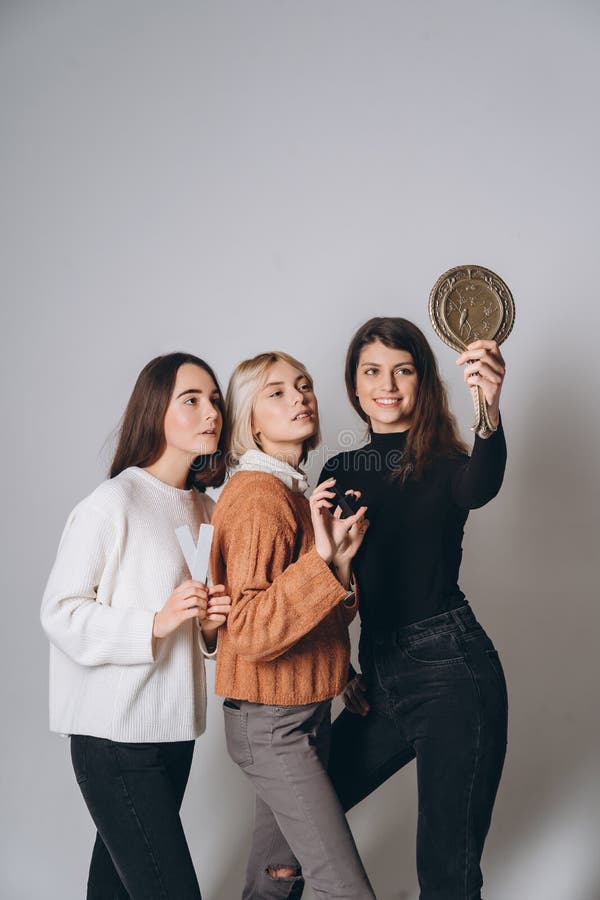 Three Beautiful Young Girls Posing for the Camera Stock Photo - Image ...