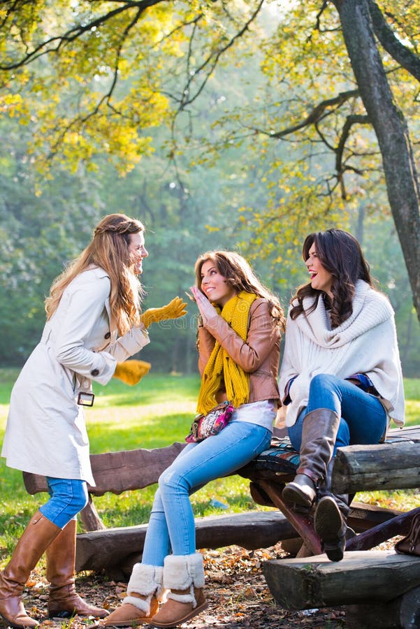 Three Young Women Jumping Joyfully in the Park Stock Image - Image of ...
