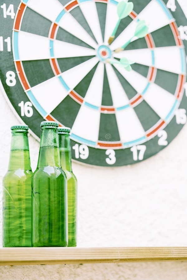 Three Beer Bottles Next To a Target Stock Photo - Image of dart ...