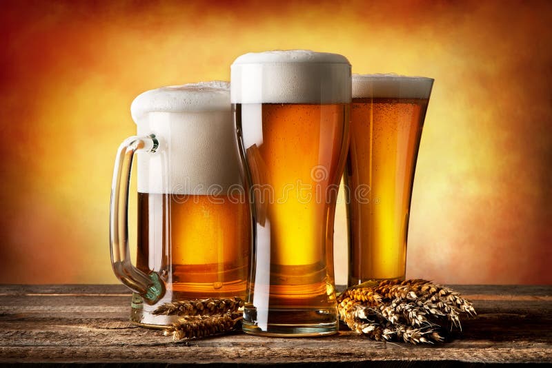 Three beers and wheat stock image. Image of brown, assortment - 52412671