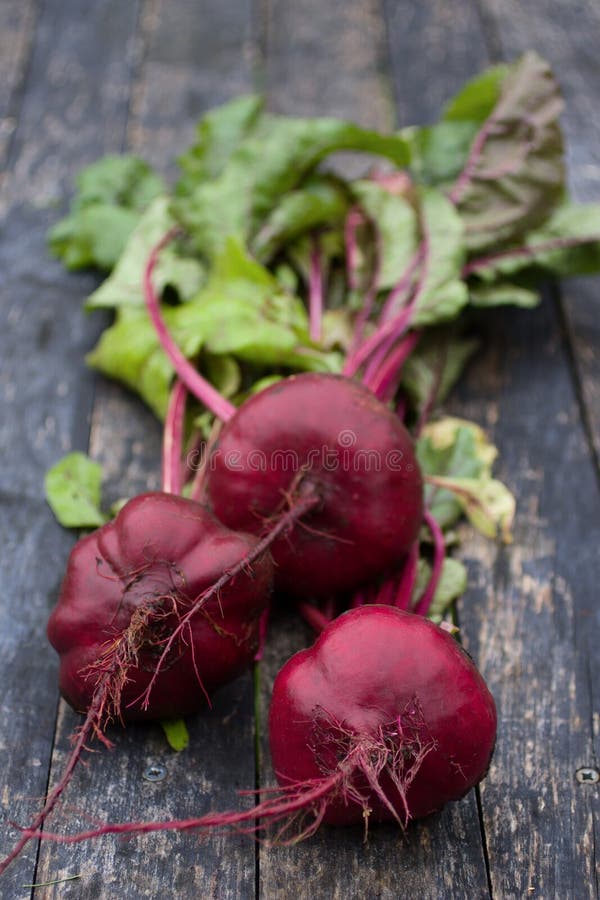 Three Beetroot on the Wooden Table Stock Photo - Image of green, pile ...