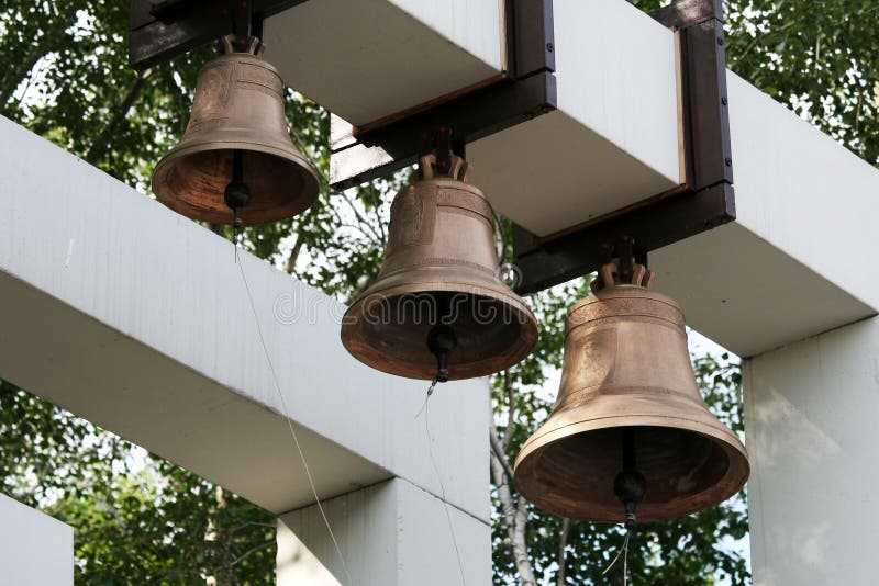 Three bells on a memorial. stock image. Image of text - 7314001