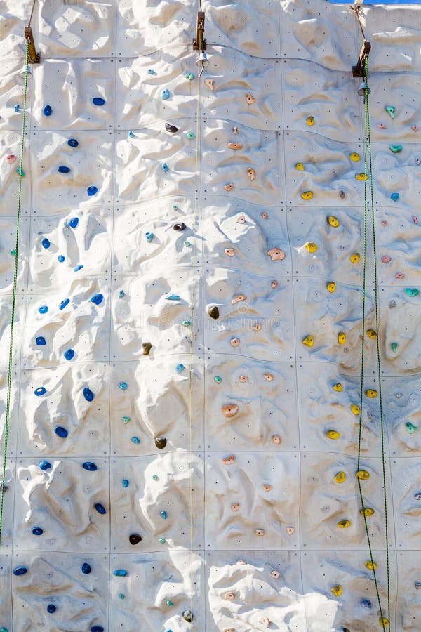 Three Bells on Rock Climbing Wall Stock Image - Image of wall ...