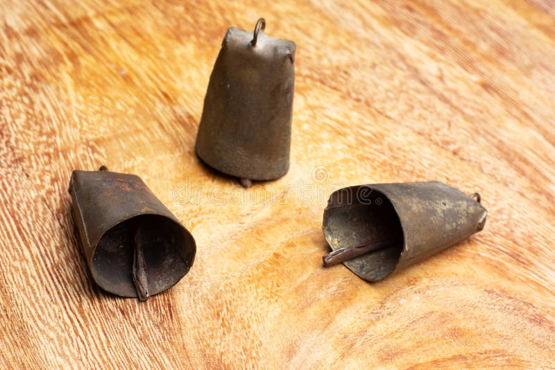 Three Bells on a Wooden Table in a Top View Stock Photo - Image of ...