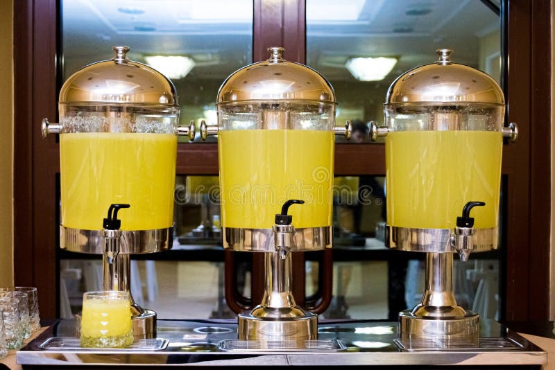 Three Beverage Dispensers with Lemonade Standing on the Table Stock ...