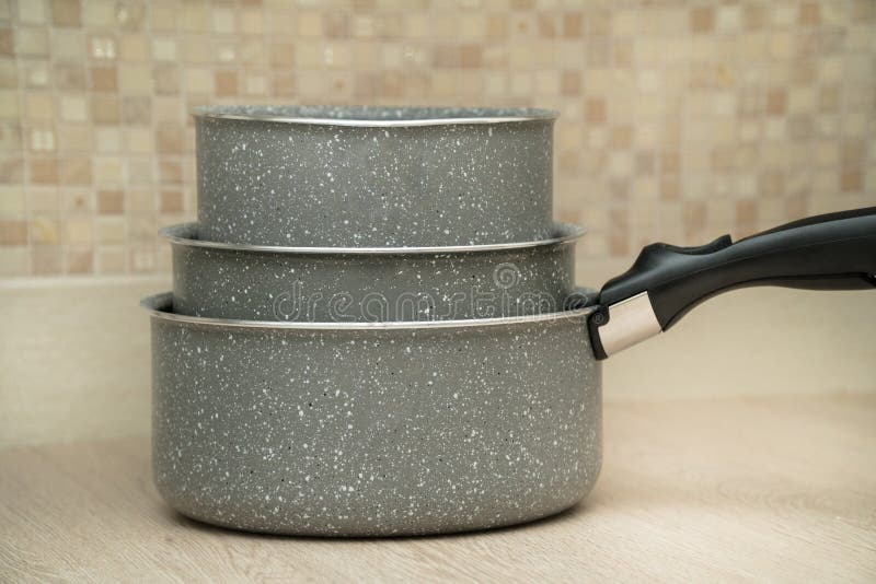 Three Big Pot in Modern Kitchen on a Wooden Table Stock Photo - Image ...