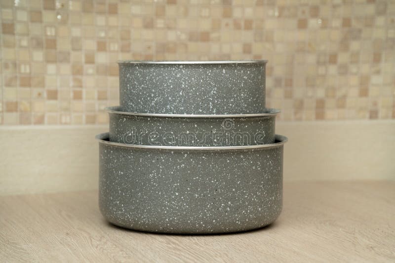 Three Big Pot in Modern Kitchen on a Wooden Table Stock Photo - Image ...