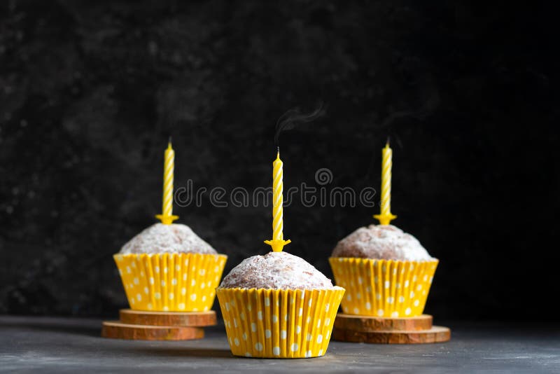 Three Birthday Cupcakes in Paper Cups with Extinguished Birthday ...