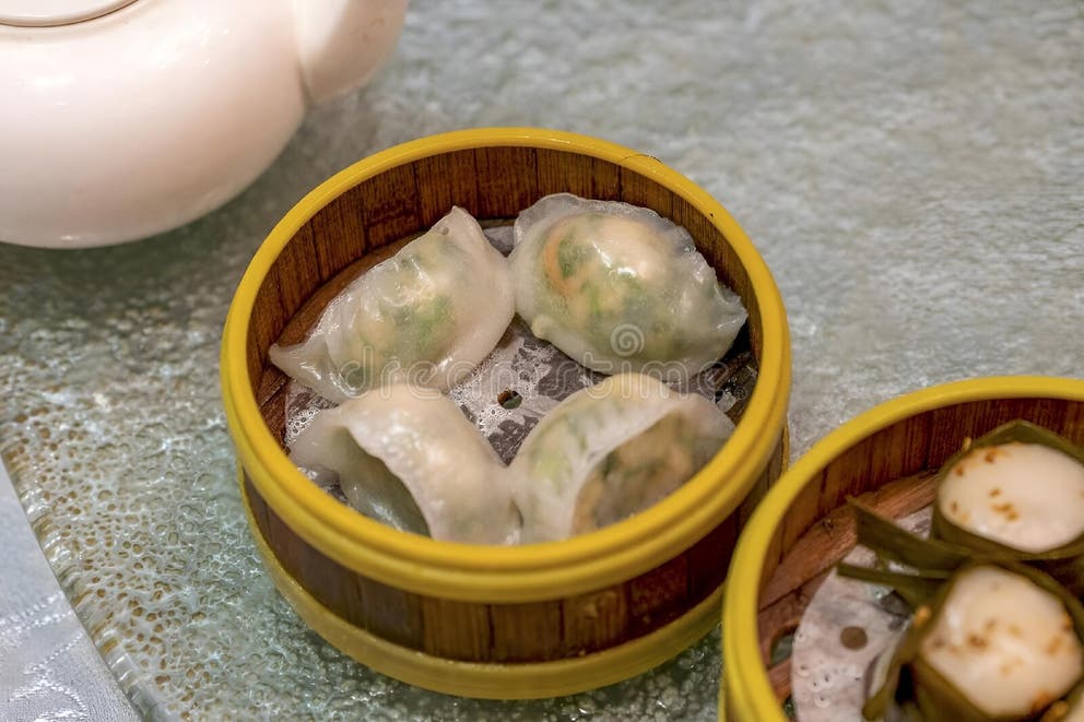 Three Small Cups of Dumplings Next To Teapots Stock Image - Image of ...