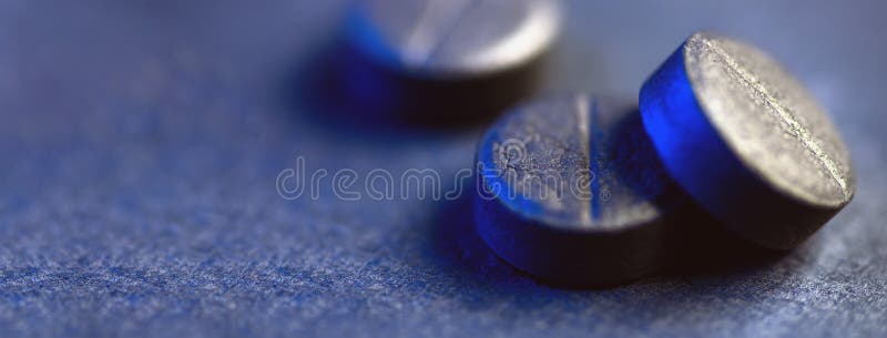 Three Black Activated Charcoal Tablets. on a Black Background Stock ...