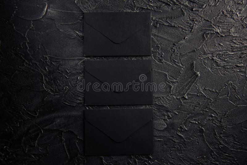 Three Black Envelopes on a Dark Background Stock Photo - Image of ...