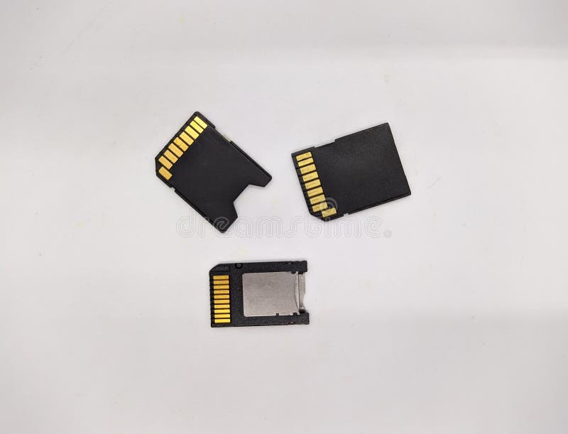 Three Black Memory Card Adapters on a White Background Top View Stock ...