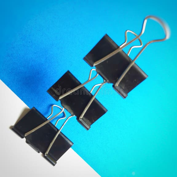 Three Black Paper Clips and Chart Clips Arranged Diagonally in White ...
