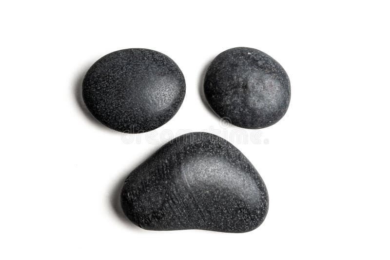 Three black pebbles stock image. Image of nature, background - 185667125